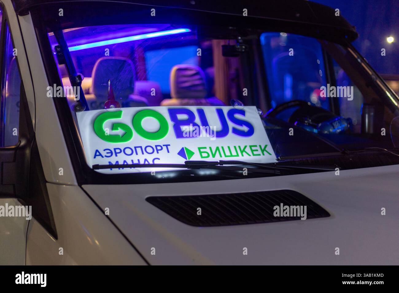 GoBus sign under windshield of shuttle bus at night Stock Photo - Alamy
