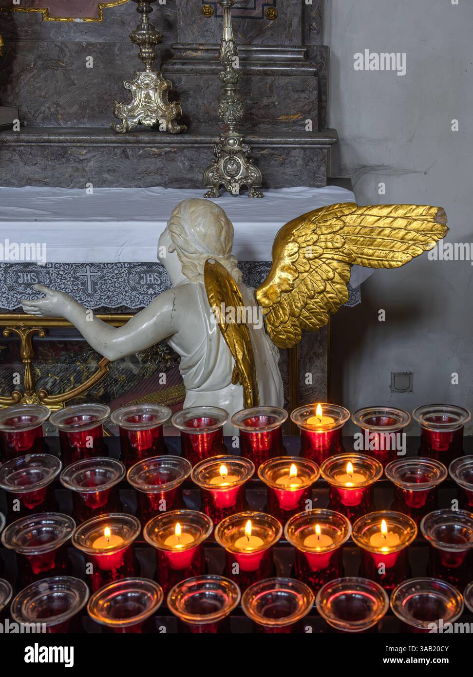 Altotting, Germany - March 19, 2025: A religious altar with a golden ...