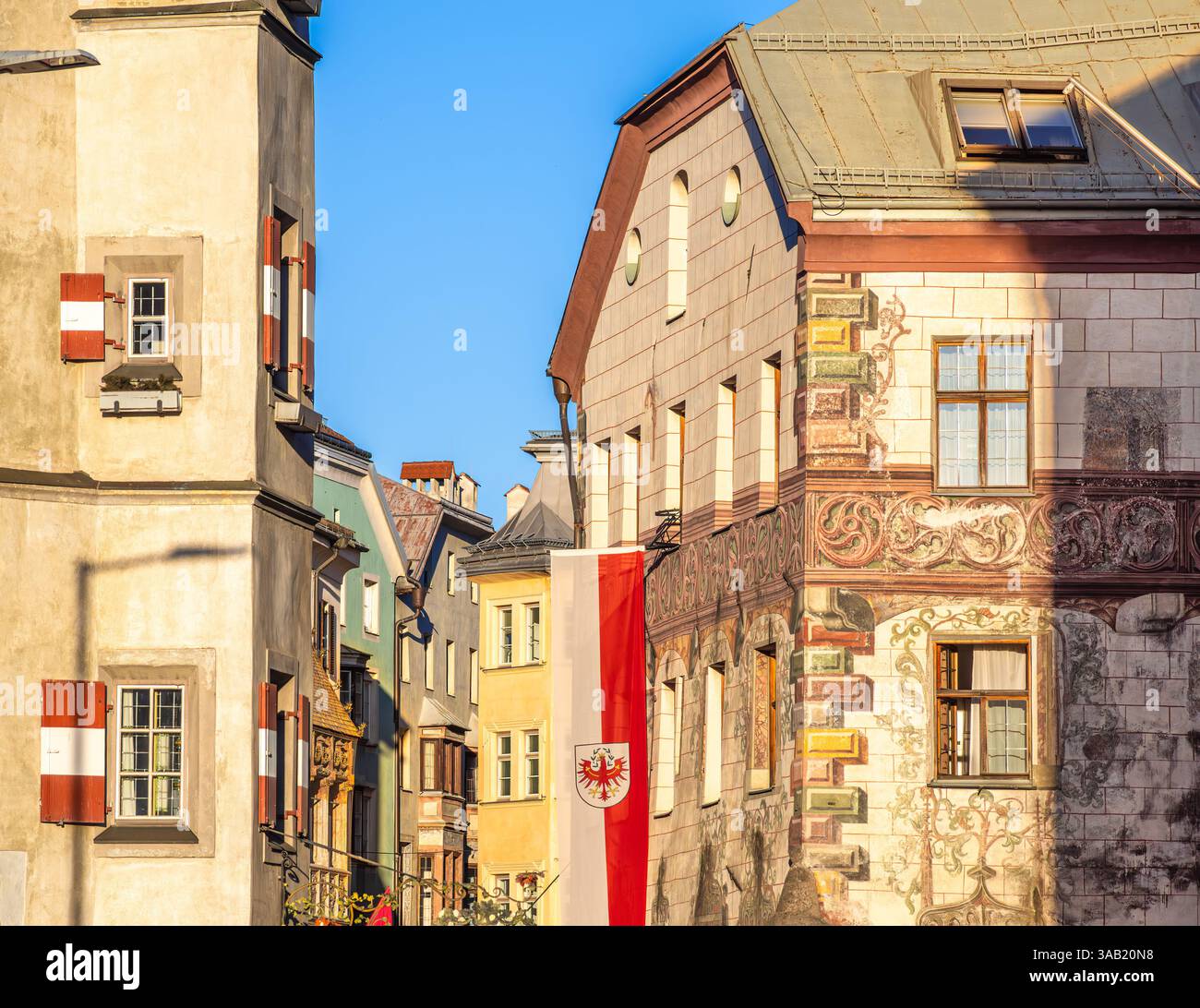 A picturesque view of historic buildings in Innsbruck with ornate ...
