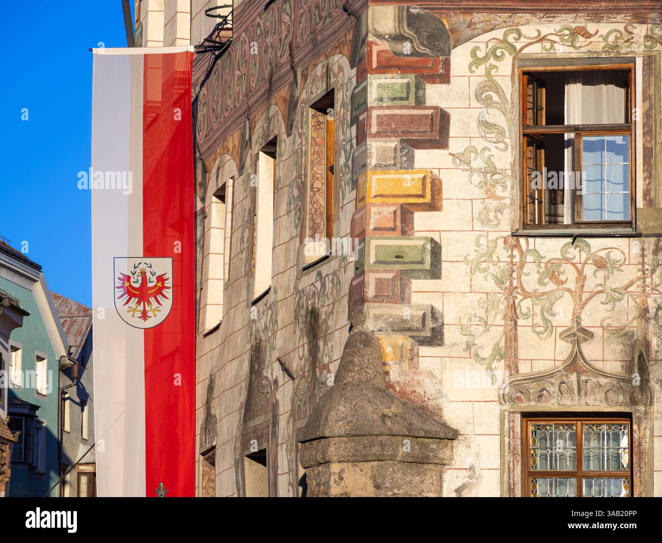 A picturesque view of historic buildings in Innsbruck with ornate ...