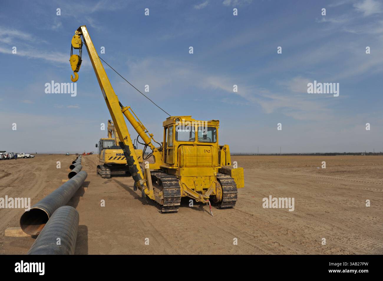 Excavator digs a trench for the construction of a gas pipeline Stock ...