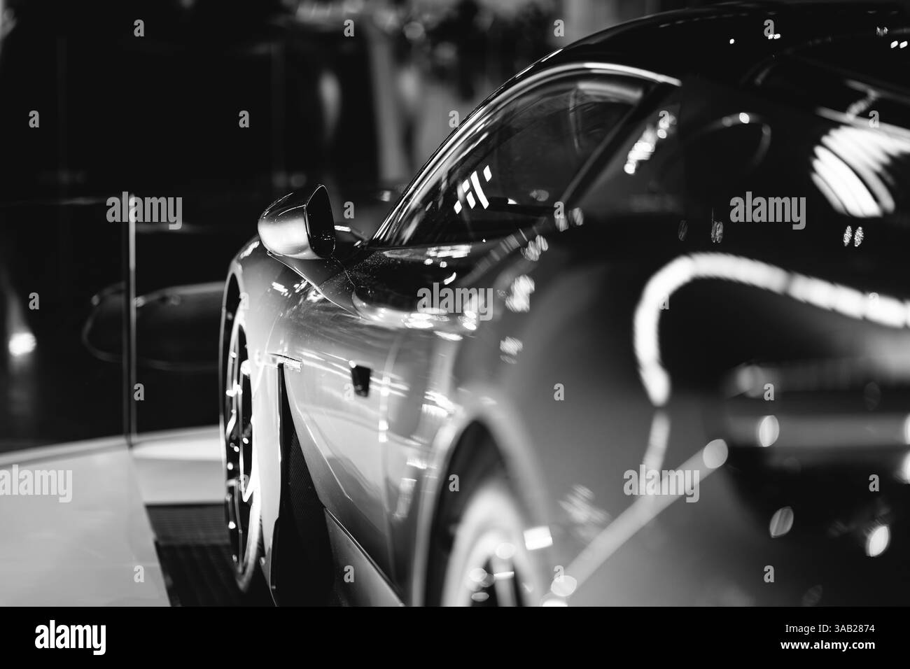 Elegant Black and White Sports Car Highlighted at Modern Auto ...