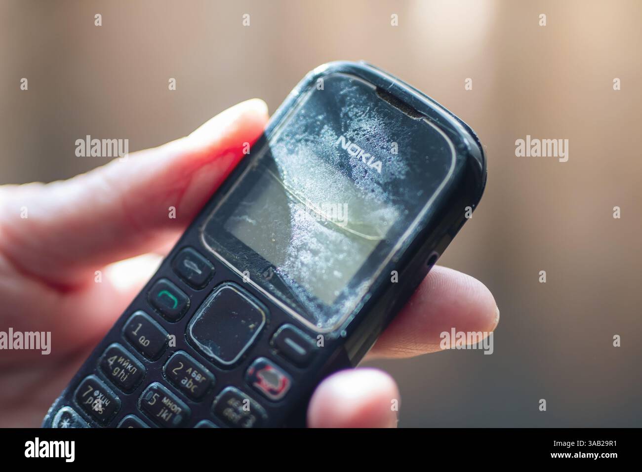 Belarus, Minsk - 09.03.2025: A person is currently holding a cell phone ...