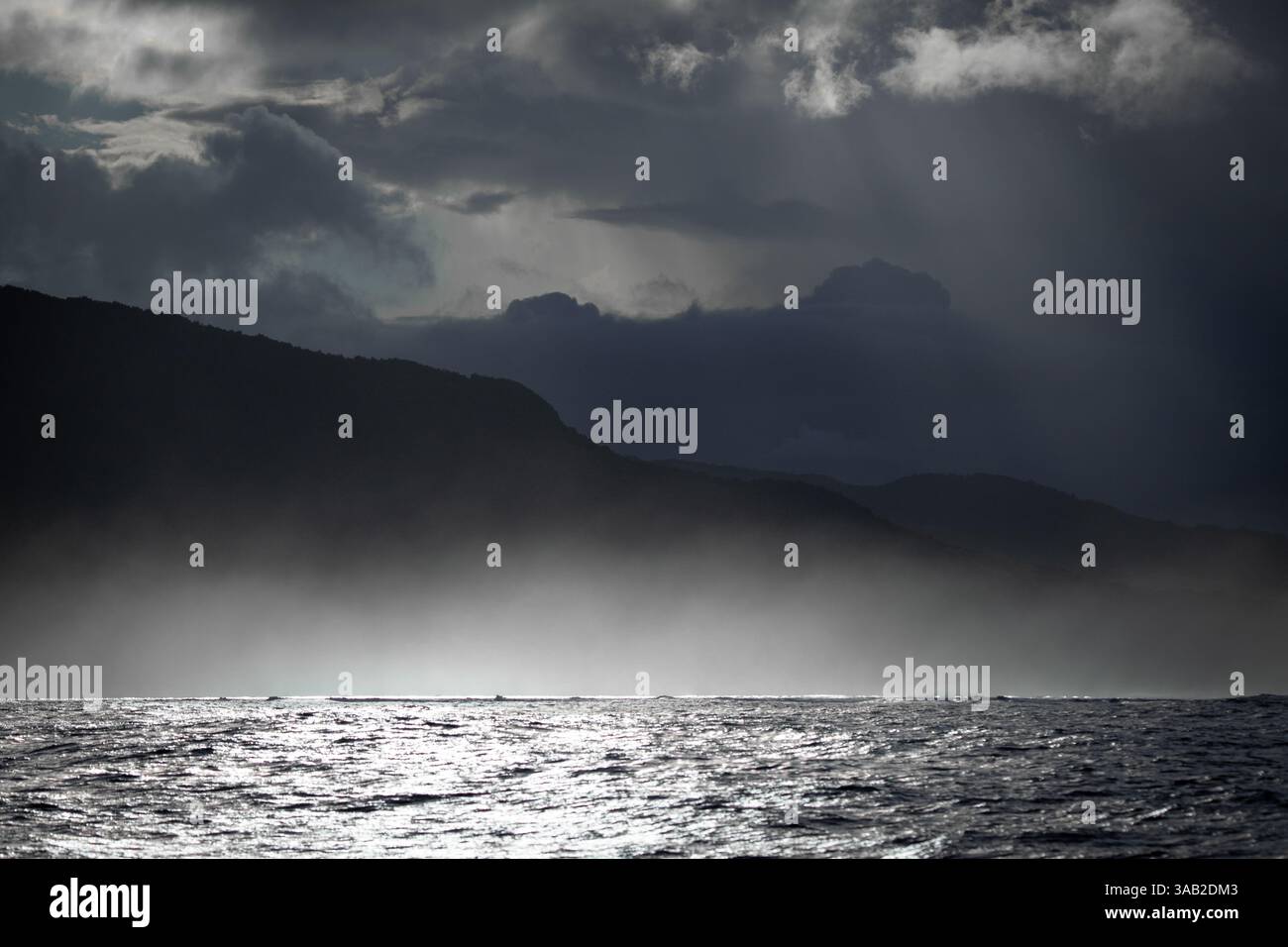 A captivating photograph of a stormy seascape with misty waves and dark ...