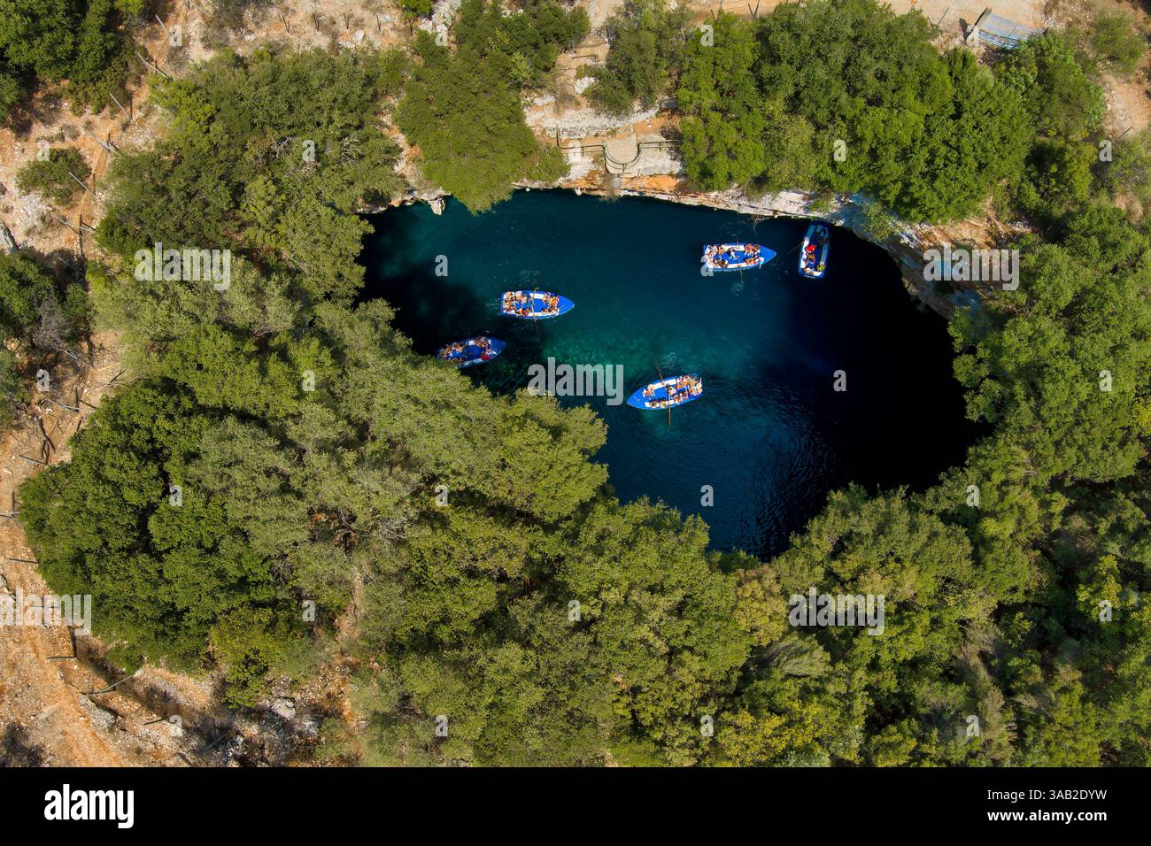 Melissani Cave in Kefalonia is a stunning underground cavern with ...