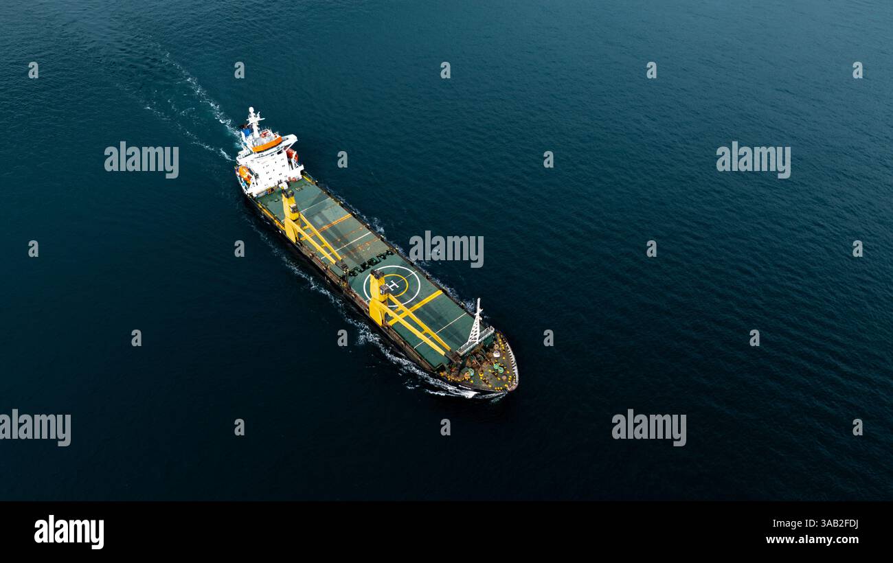 Tanker ship passing under the FSM Bridge with a heavy car traffic on ...