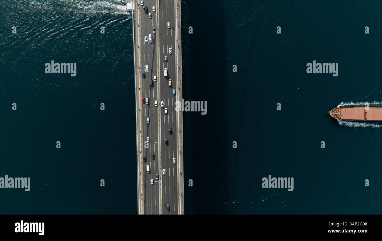 Tanker ship passing under the FSM Bridge with a heavy car traffic on ...