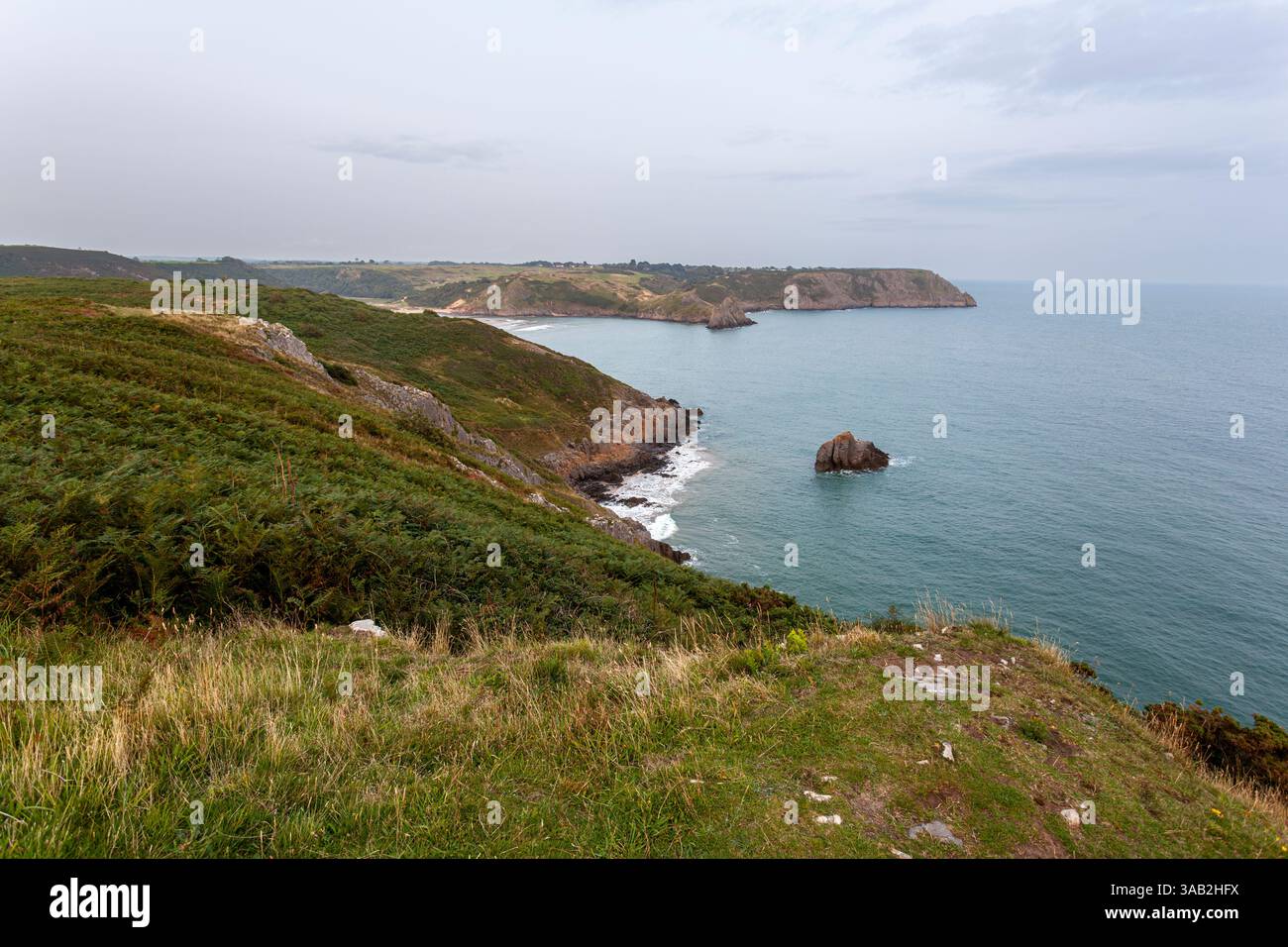 The jagged rock formation that gives Three Cliffs Bay, a popular ...