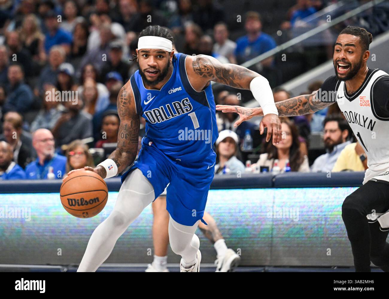 Dallas Mavericks guard Jaden Hardy drives by Brooklyn Nets guard D ...
