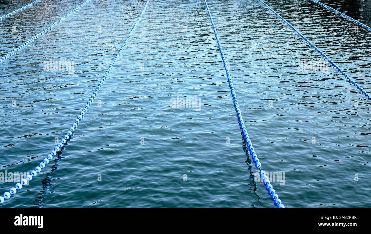 Wide Shot of an Outdoor Pool with Blue Swimming Lane Markings and Clear ...