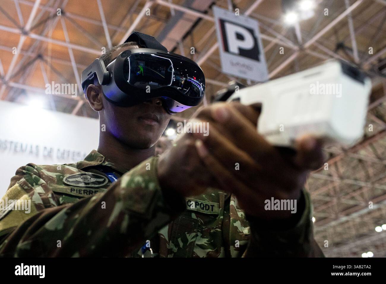 A Brazilian army soldier uses a shooting simulator at the LAAD Defense ...