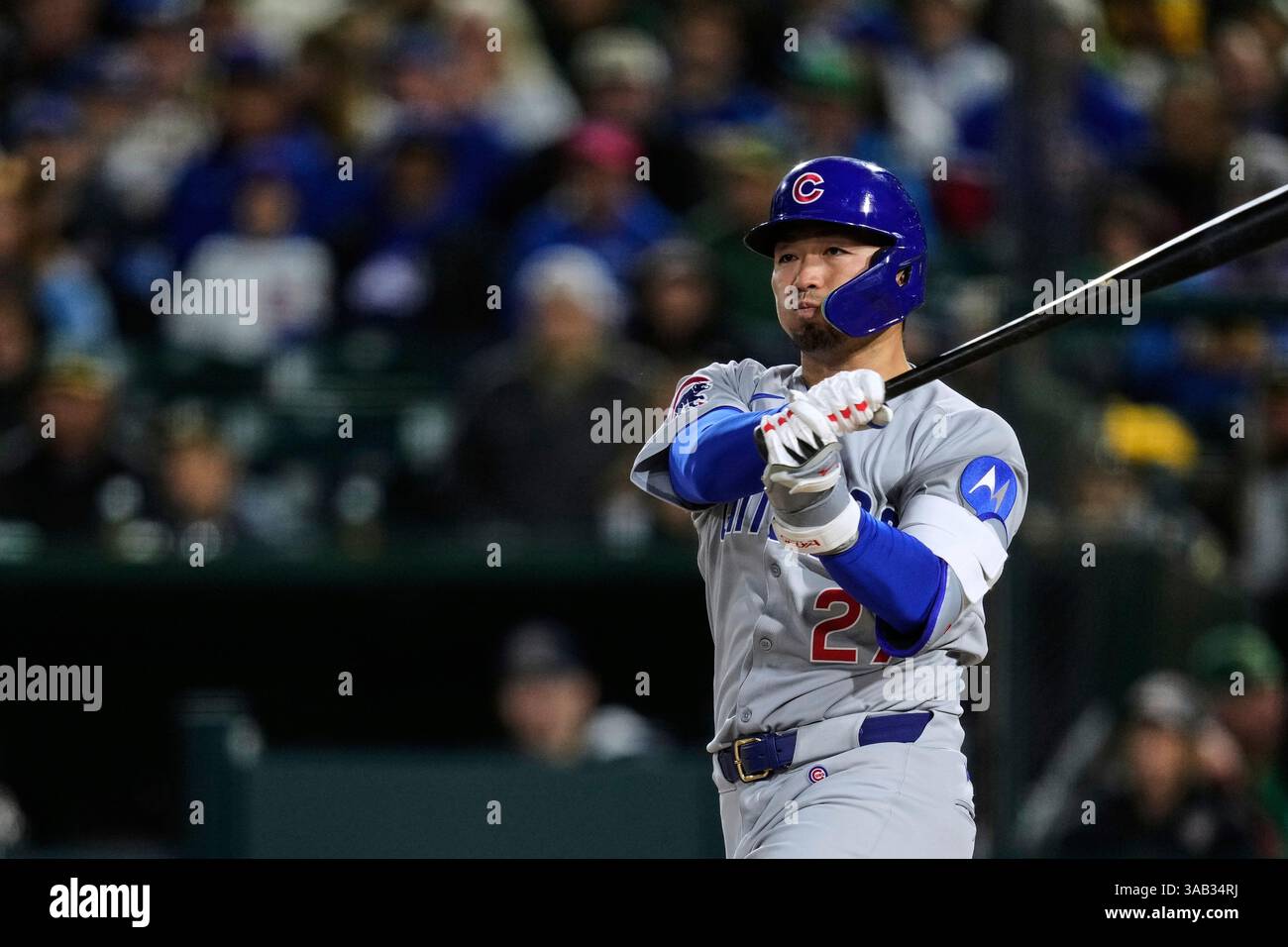 Chicago Cubs' Seiya Suzuki follows through his swing during a baseball ...