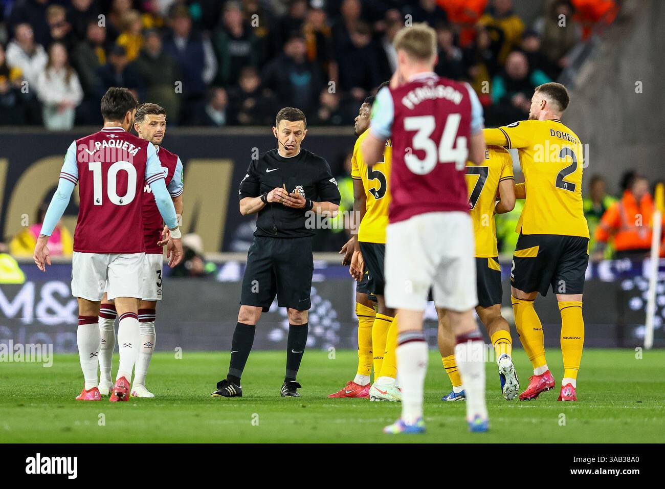 Referee, Tony Harrington puts a name in the book during the Premier ...