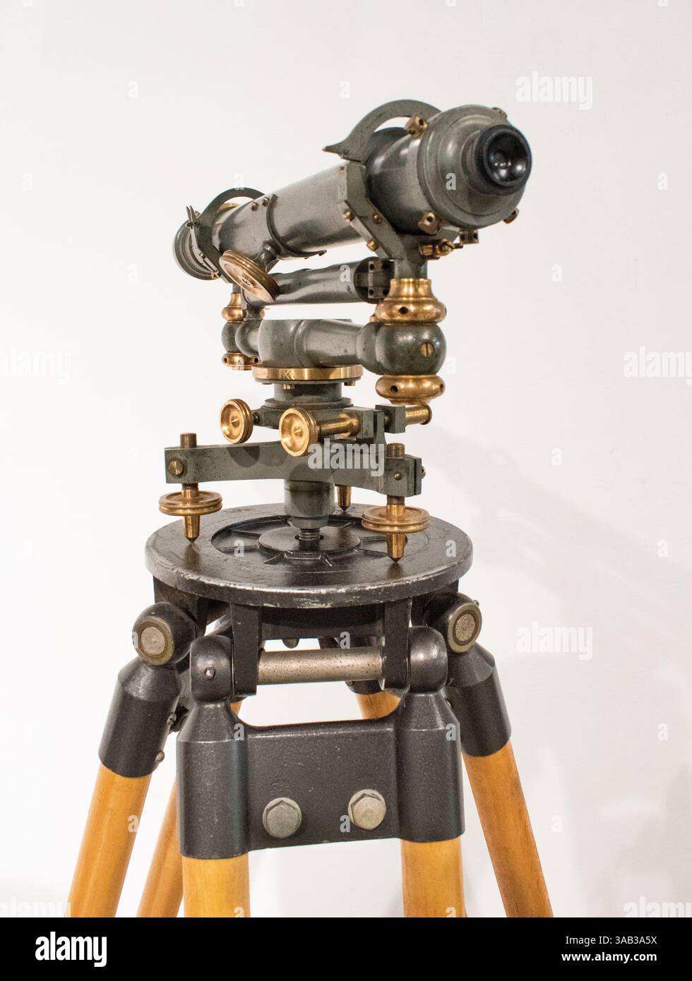old surveying instrument, on a white background Stock Photo - Alamy