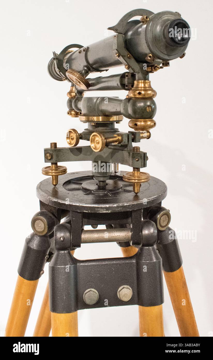 old surveying instrument, on a white background Stock Photo - Alamy