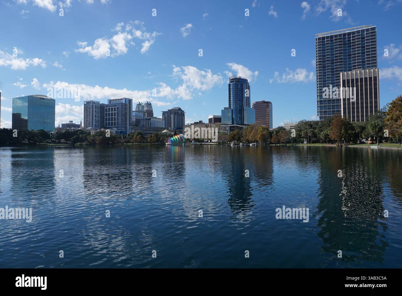 Scenic panorama of Lake Eola Park with the famous water fountain, Walt ...