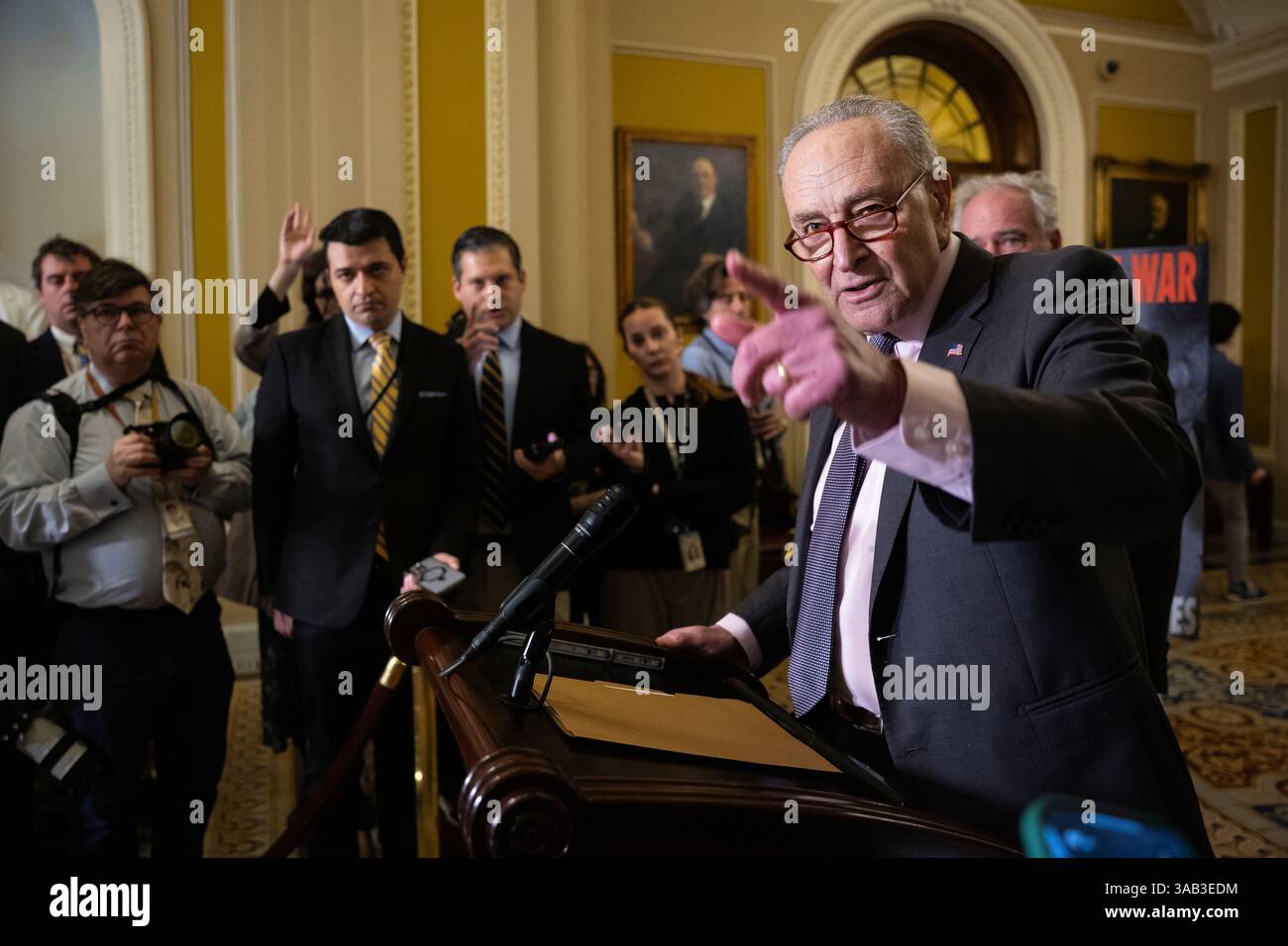 Senate Minority Leader Chuck Schumer (D-N.Y.) calls on a reporter ...