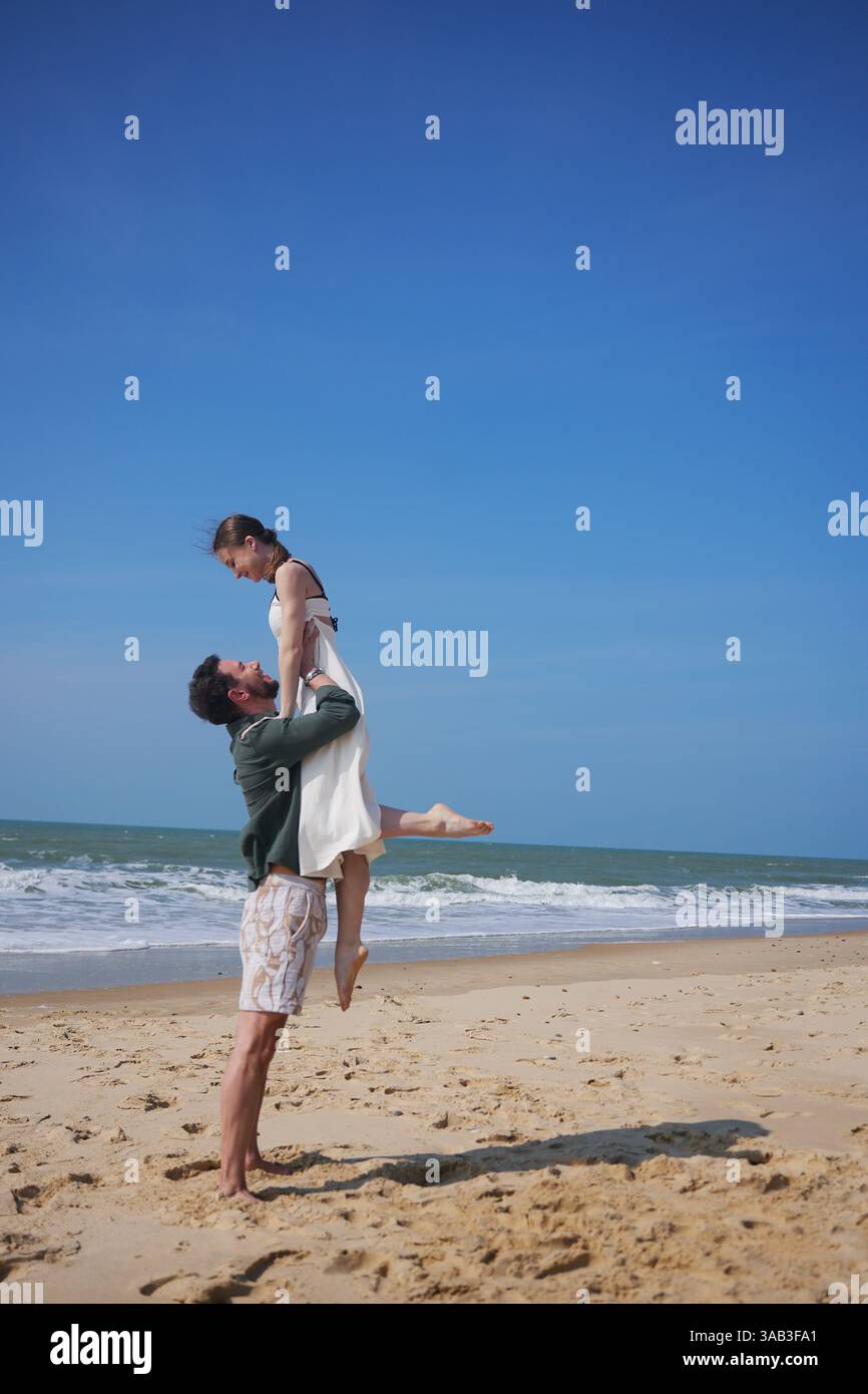 Playful moment between loving couple hi-res stock photography and ...