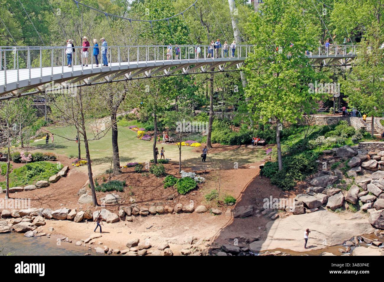 Greenville South Carolina Liberty Bridge waterfall in Falls Park on the Reedy River downtown ...