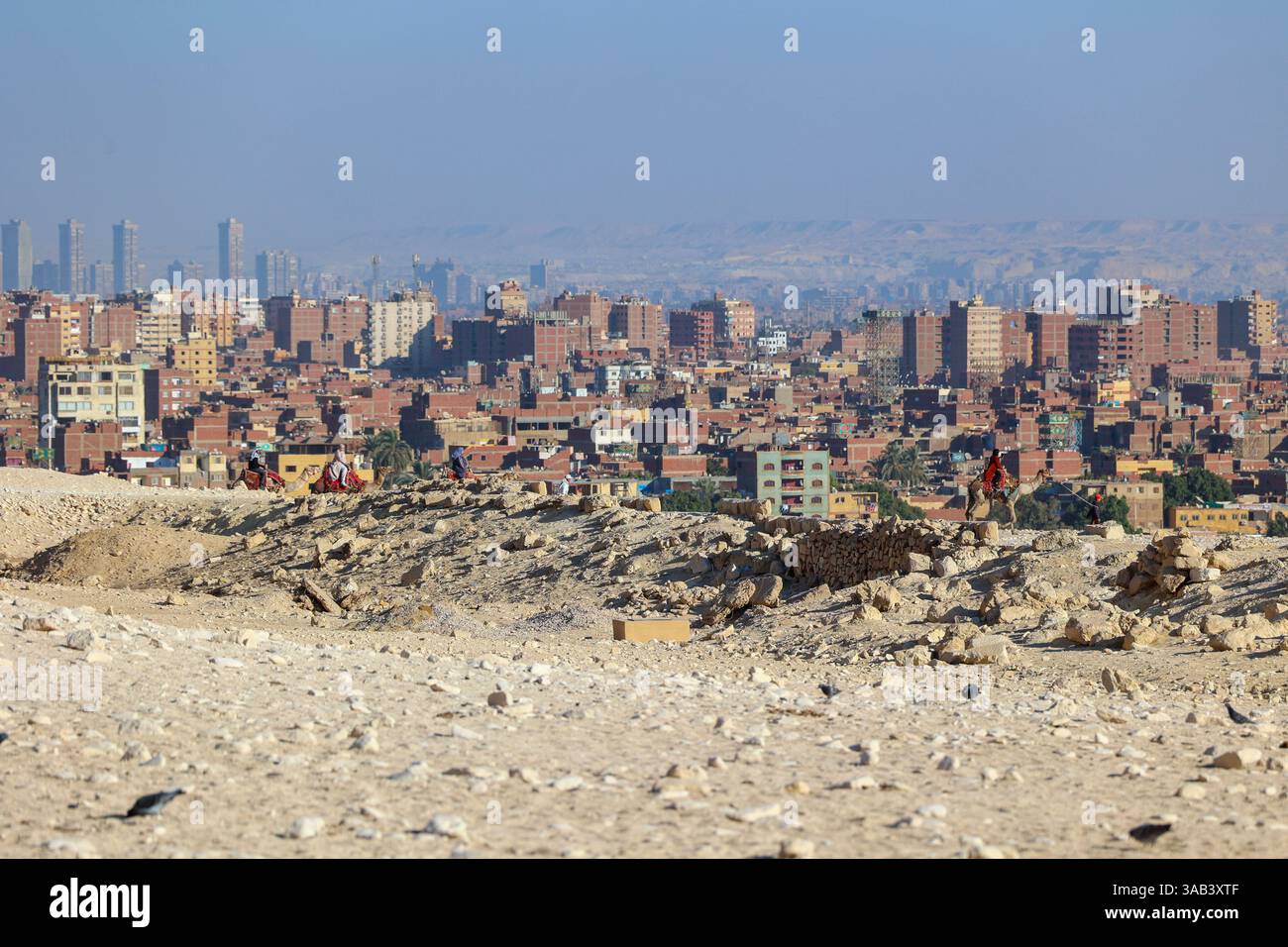 View from the pyramid complex in Giza, Egypt, to the high-rise ...