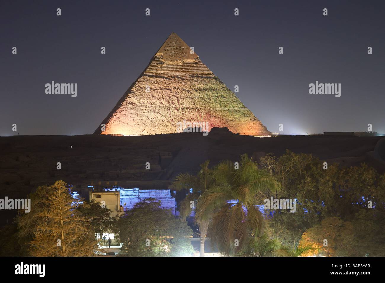 Egyptian pyramid complex in Giza at night with the largest pyramid ...