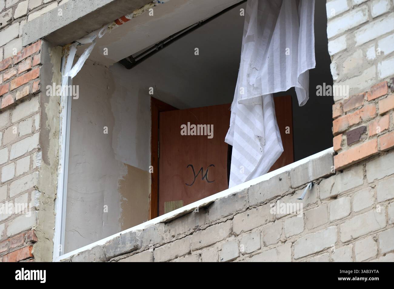 Non Exclusive: A window smashed by the shock wave frames the interior ...