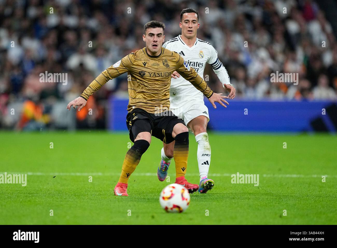 Ander Barrenetxea of Real Sociedad and Lucas Vazquez of Real Madrid in action during the Spanish ...