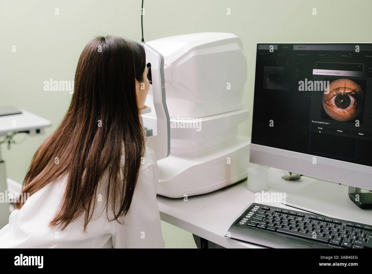 Examination of eyes of patient using optical coherence tomograph ...