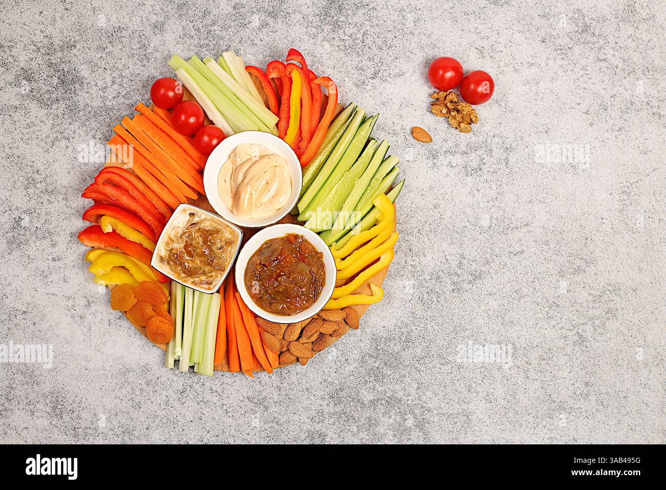 Healthy food kitchen background with hummus bowl and raw vegetable ...