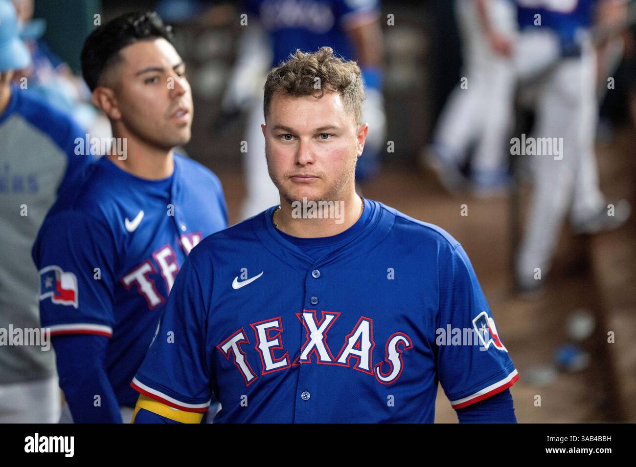 Texas Rangers' Joc Pederson walks in the dugout during a spring ...