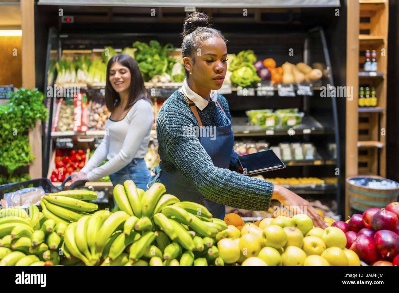 Grocery store employee arranging hi-res stock photography and images ...