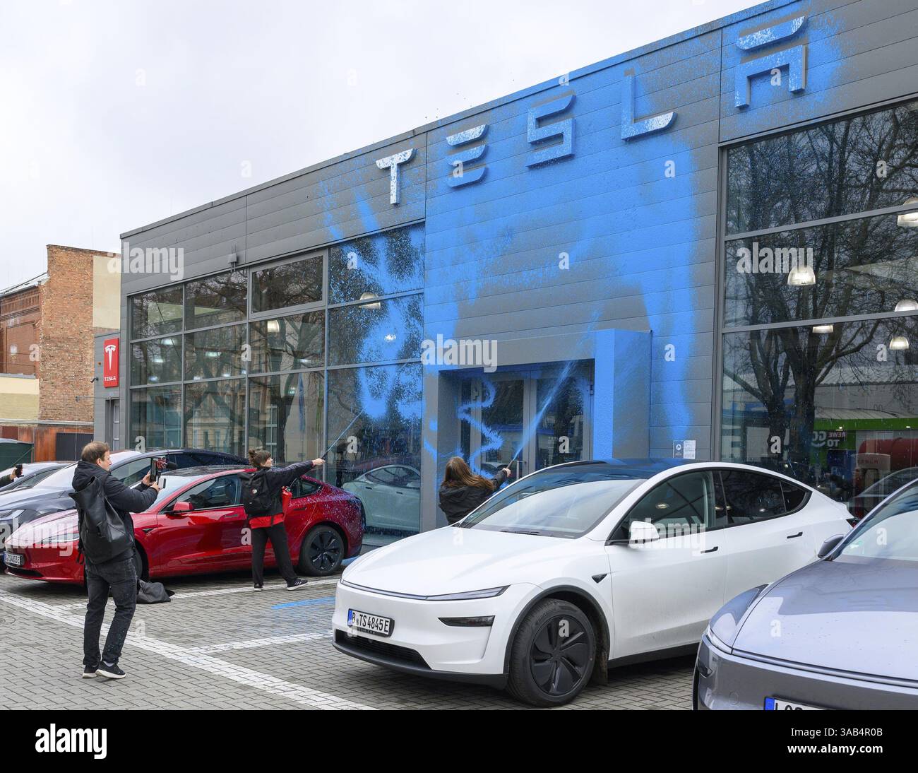 Emma Dorrow and Judith Beadle from the New Generation spray TESLA store ...