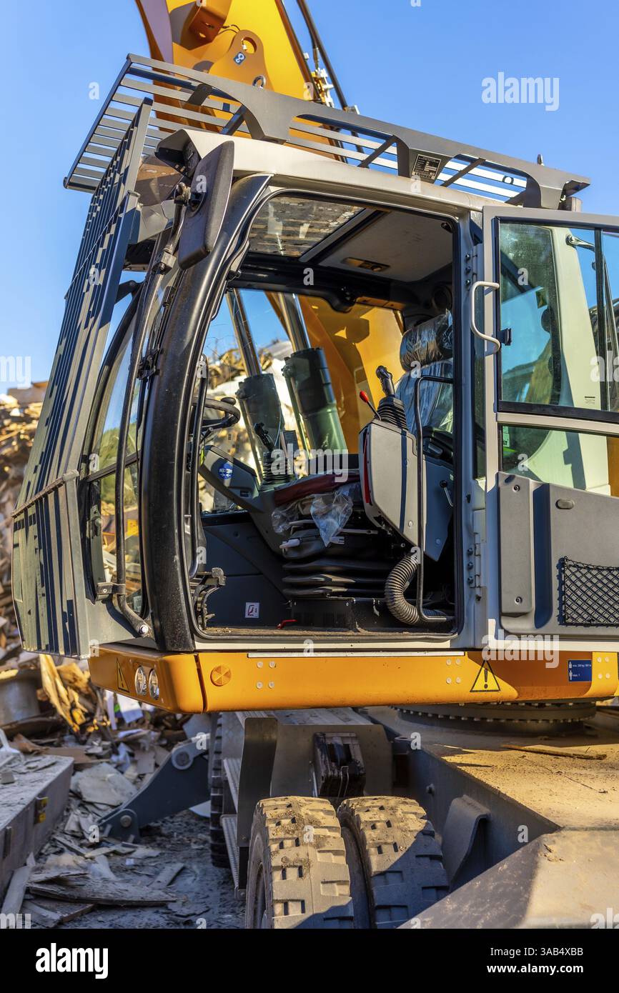 Vertical photo with no people and close-up of an excavator outside a ...