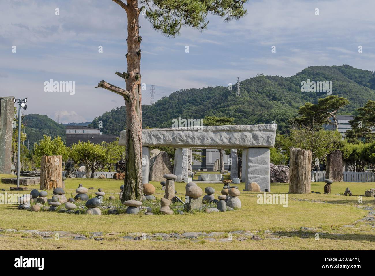 Gimcheon, South Korea, May 24, 2020: Tree in middle of stone stacks ...
