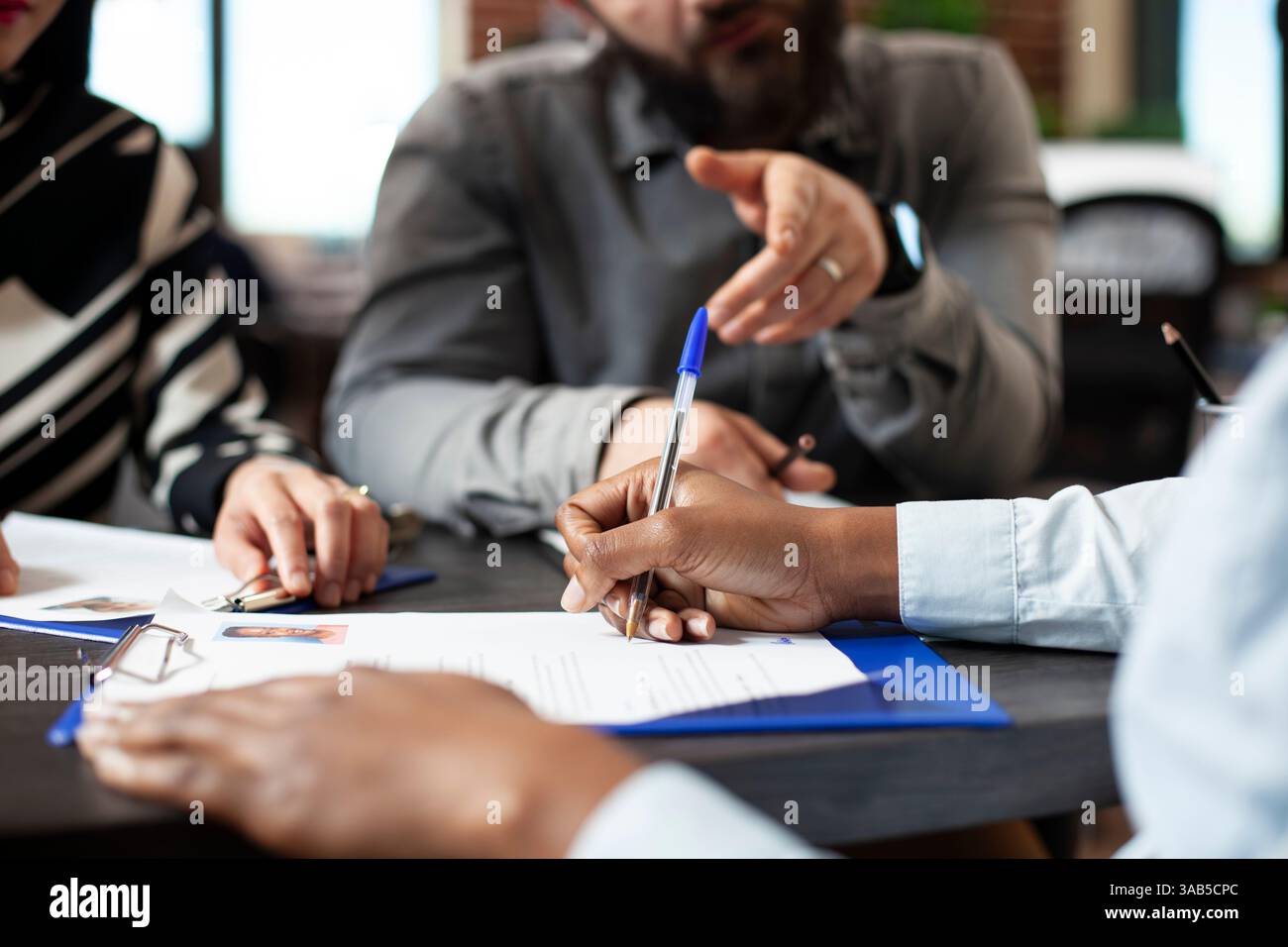 Job candidate signing recruitment documents hi-res stock photography ...