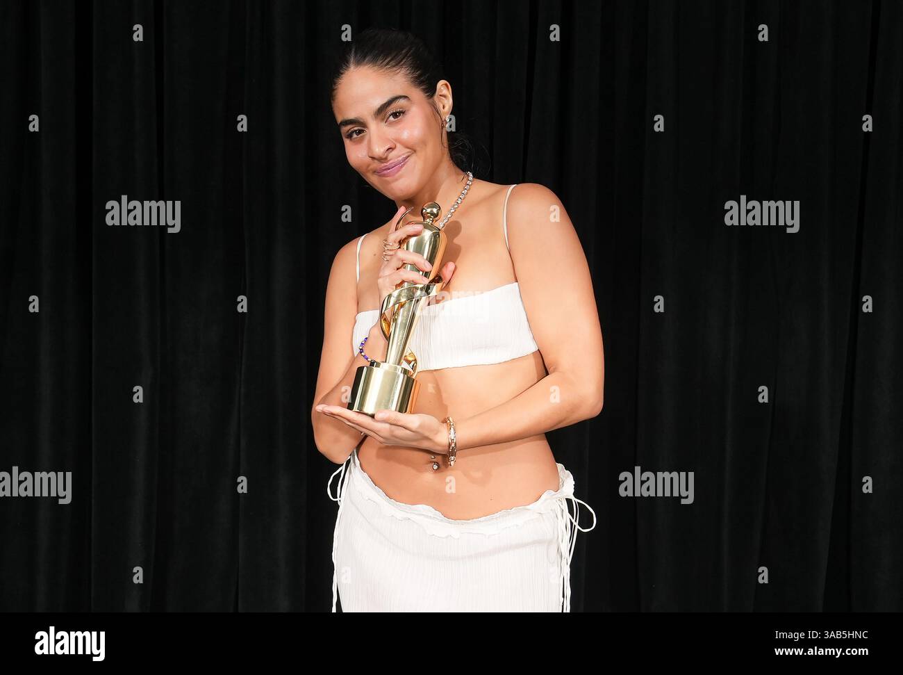 Vancouver, Canada. 30th Mar, 2025. Jessie Reyez poses for photos after ...