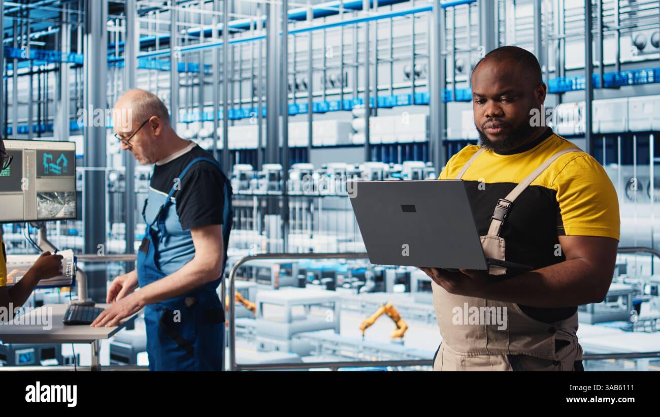 Industry 4.0 industrial plant engineer automating robotic machines ...