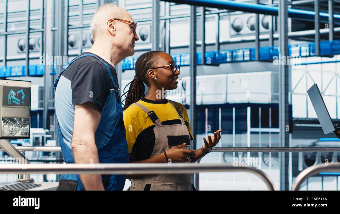 Investor visiting industry 4.0 solar panels plant, talking with engineers to ensure limited ...