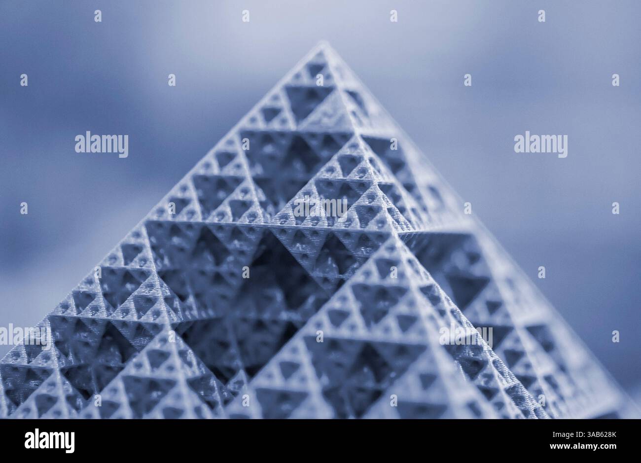 Small model of pyramid printed on 3D printer close-up. Object created ...