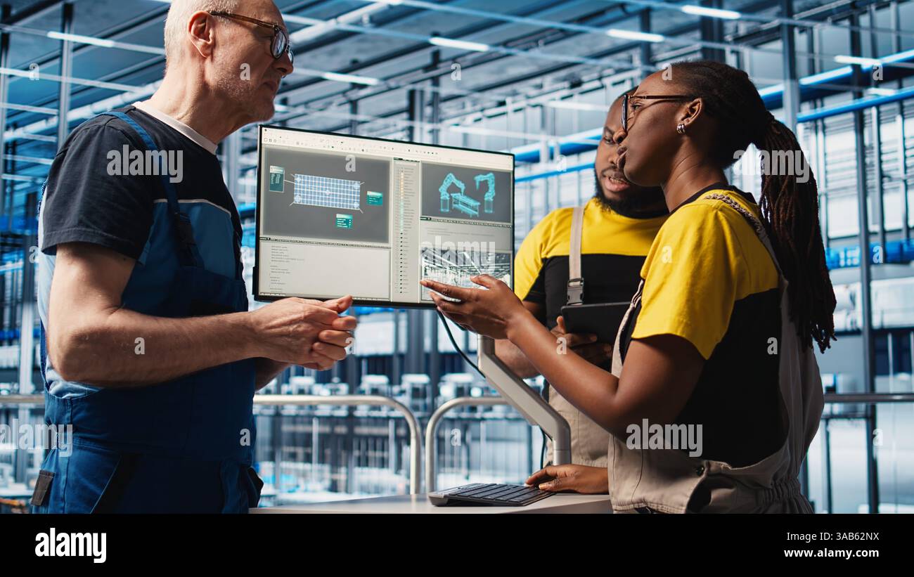 Photovoltaics smart factory elderly team leader talks with workers diagnosing damaged IoT ...