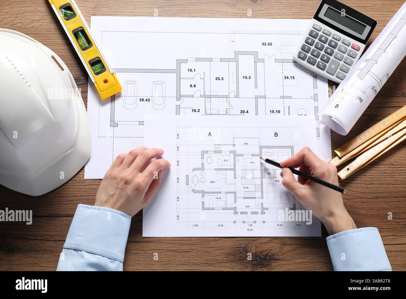 Architect working with project, top view. Different technical drawings ...