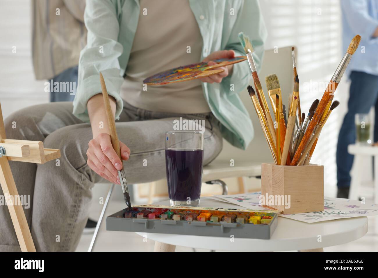 Male hand brush during painting hi-res stock photography and images - Alamy