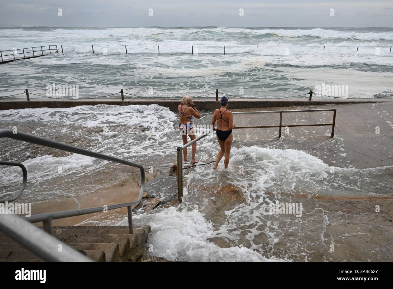 Sydney, Australia. 02nd Apr, 2025. Two swimmers brave wild conditions ...