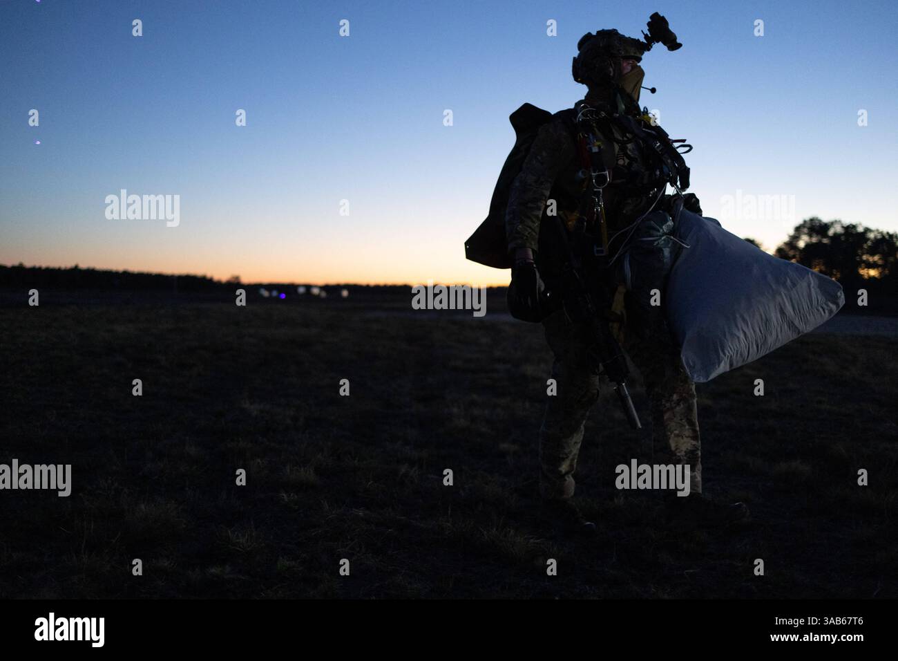 Military special forces make a parachute jump on sunset during The ...