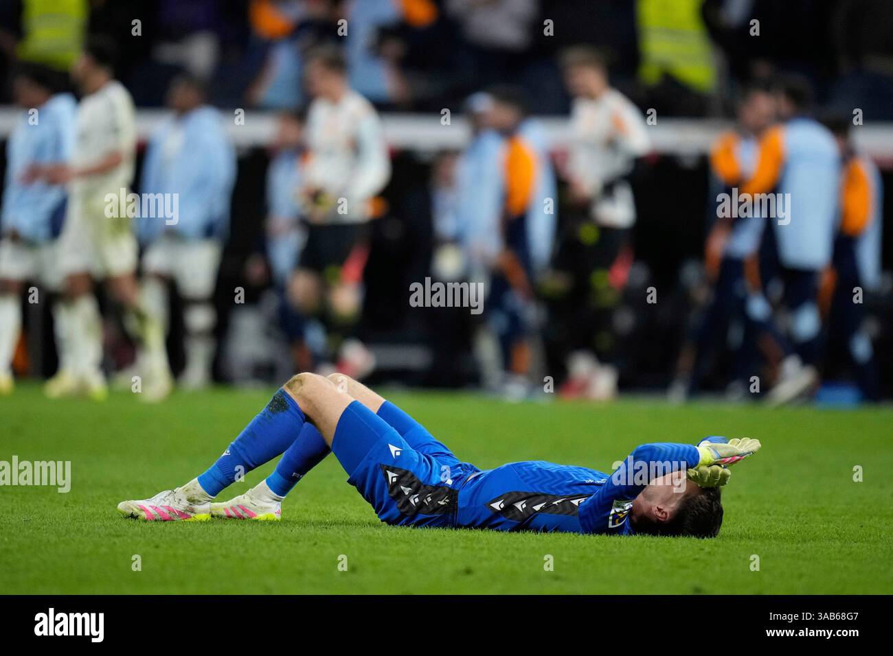 Real Sociedad's goalkeeper Alex Remiro lies dejected after the Spanish ...