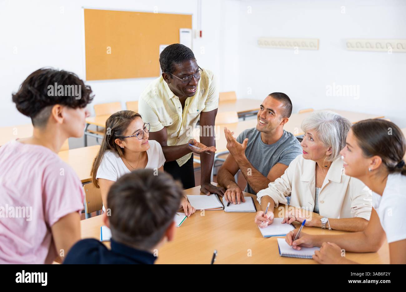 Different people studying foreign languge together Stock Photo - Alamy
