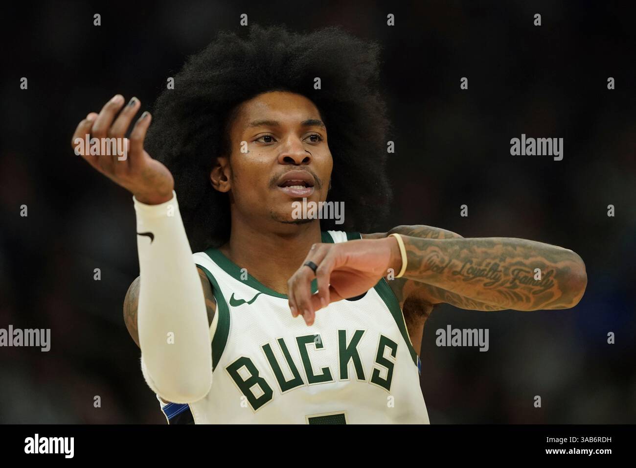 Milwaukee Bucks' Kevin Porter Jr. gestures during the first half of an ...