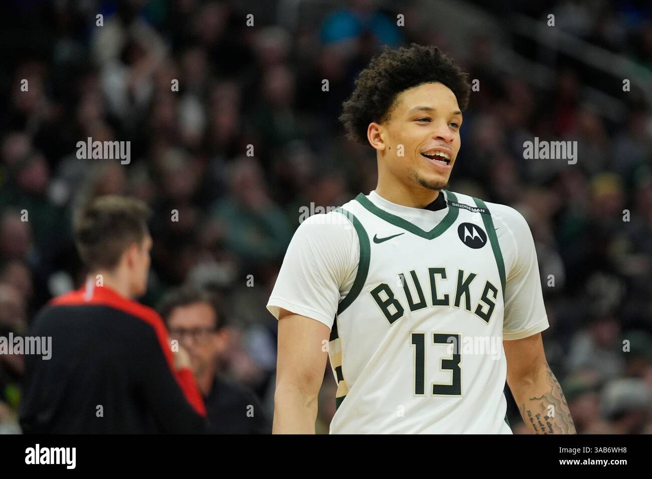 Milwaukee Bucks' Ryan Rollins smiles during the first half of an NBA ...