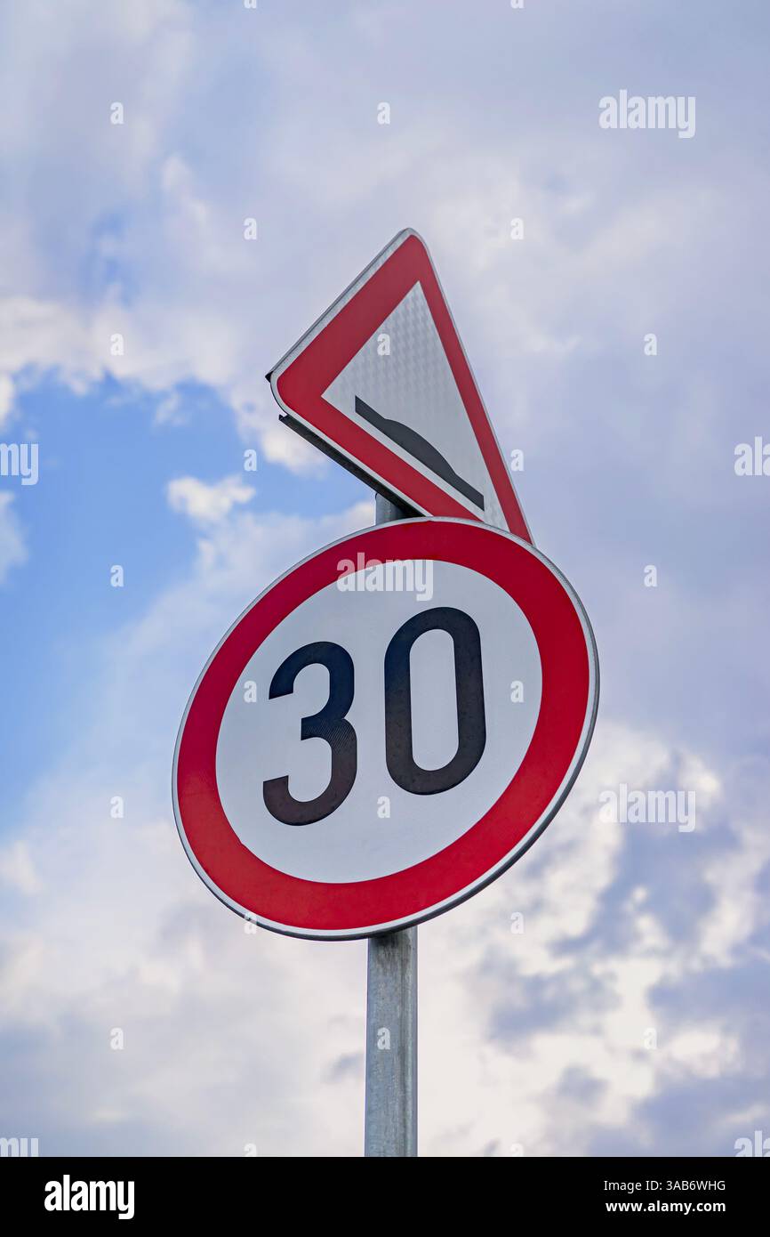 Speed limit sign showing 30 km on background of cloudy sky, cautionary message. Speed limit sign ...