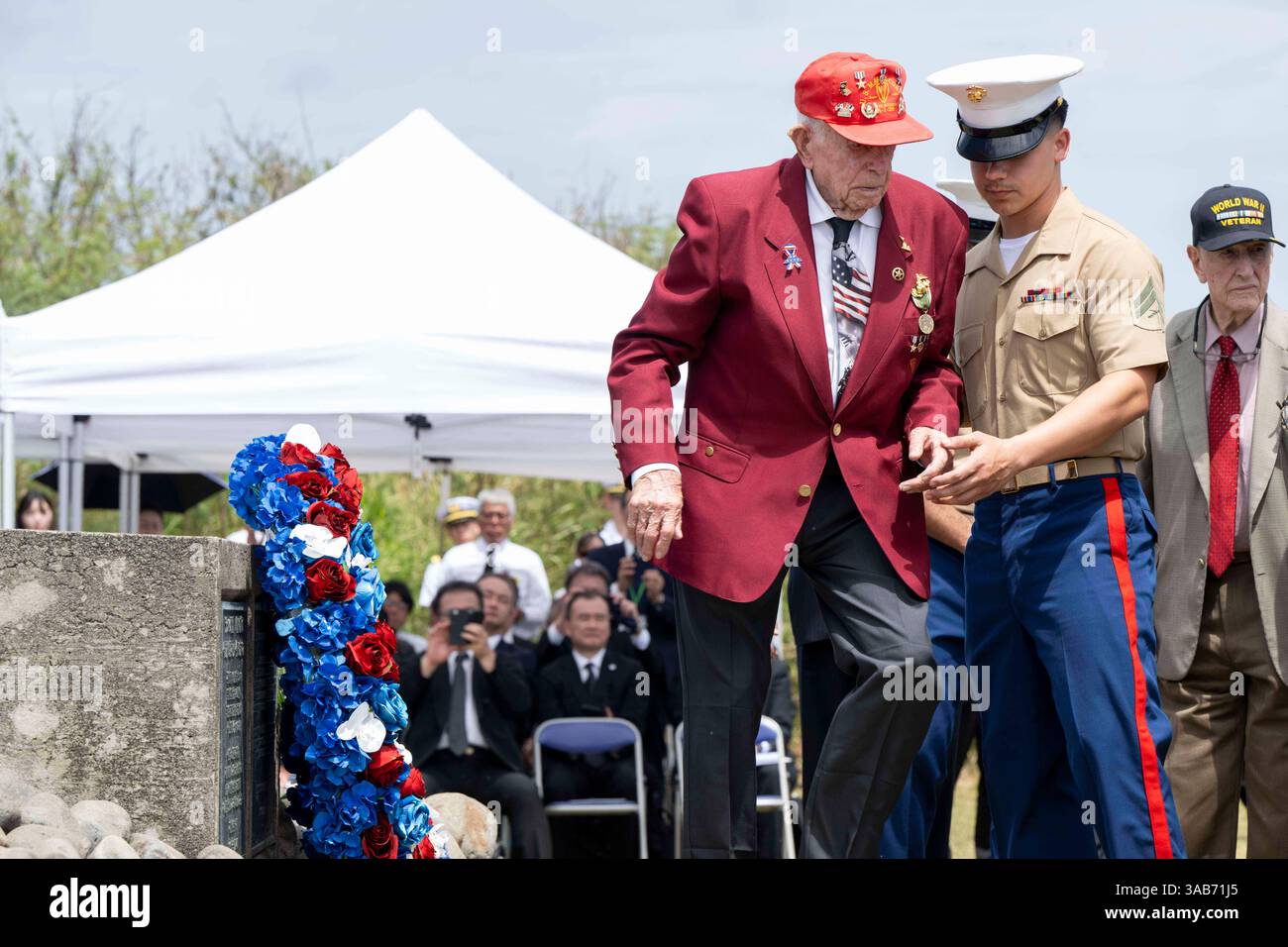 Iwo Jima, Japan. 28th Mar, 2025. A U.S. Marine Corps Marine helps a ...